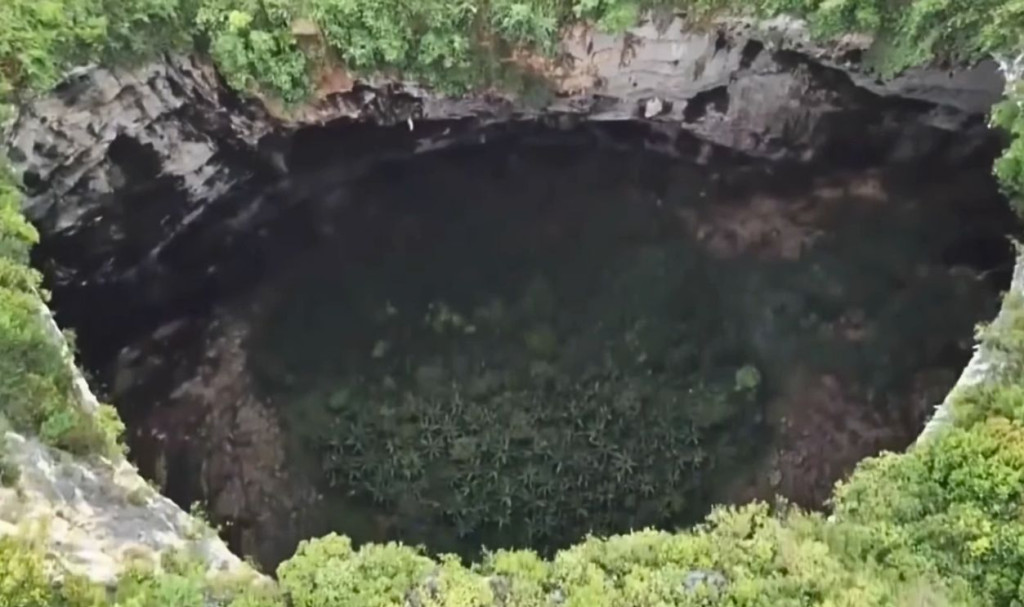 After a 630-foot sinkhole opened up in China, the first explorers to ...